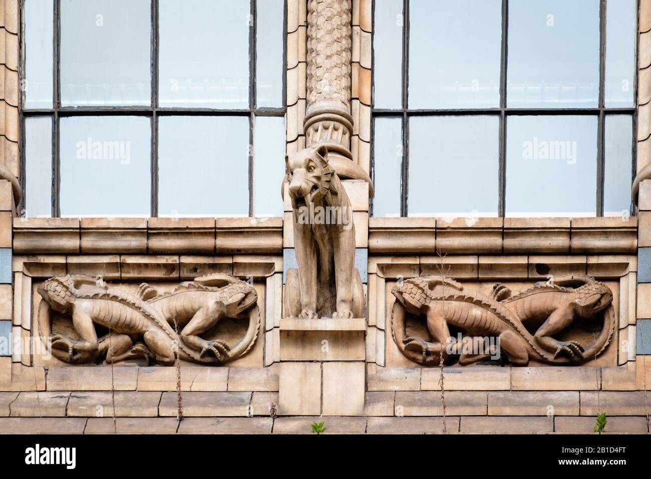 Dire wolf and reptile gargoyles carved on the exterior of Natural ...