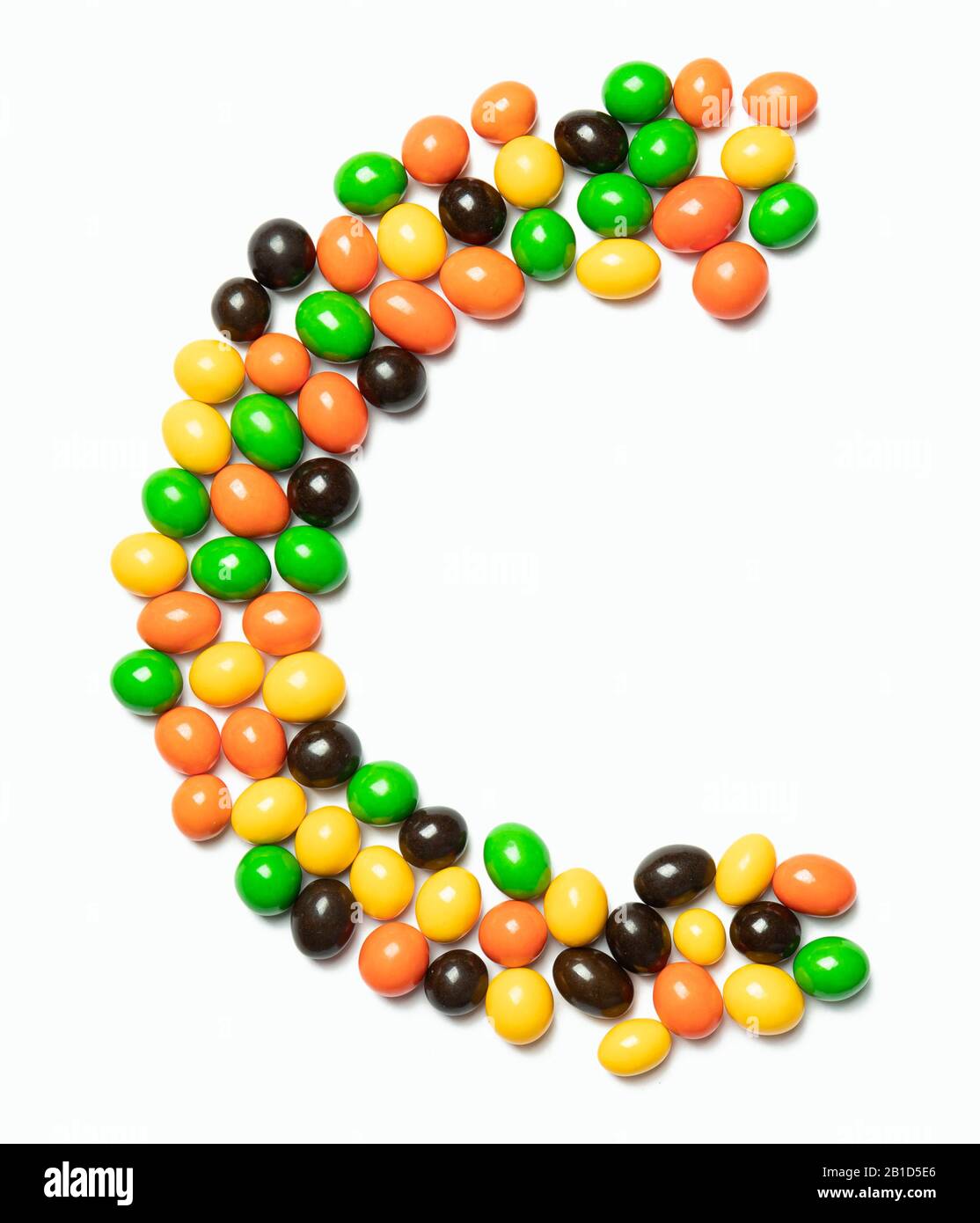 Letter C of the English alphabet from multicolored round chocolates on ...