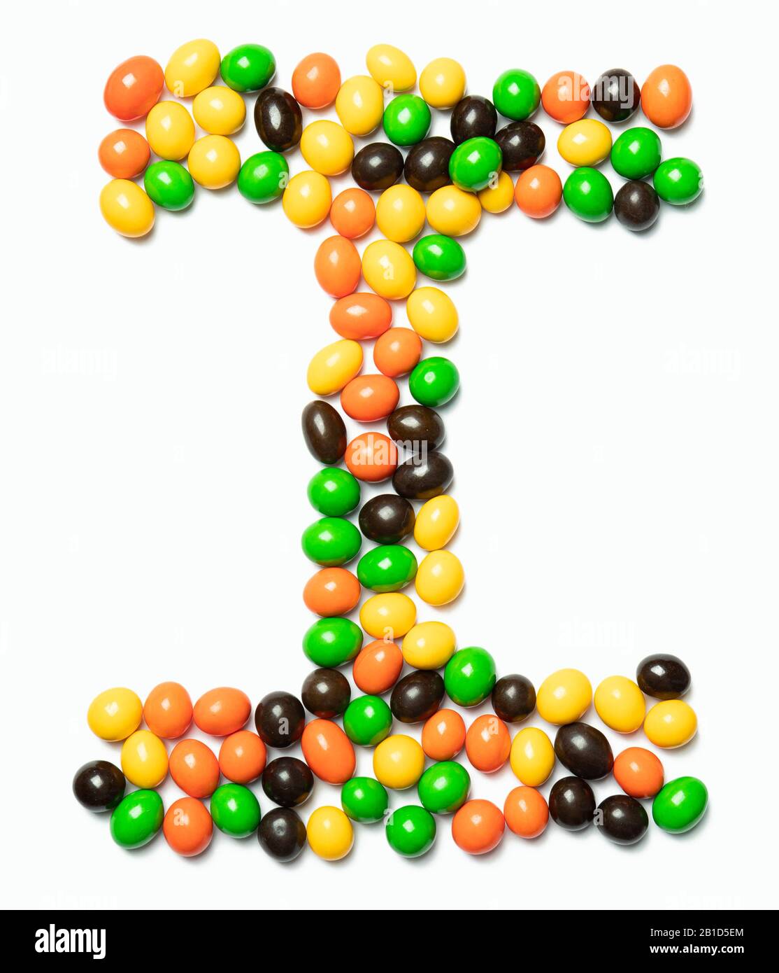 Letter I of the English alphabet from multicolored round chocolates on ...
