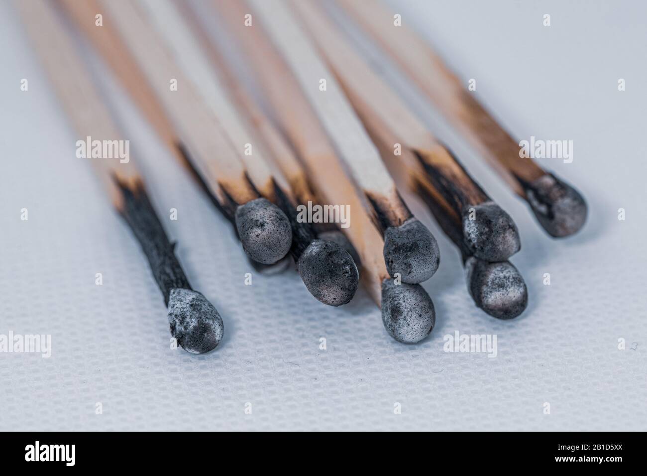 several burned matches lie side by side on a white base Stock Photo - Alamy