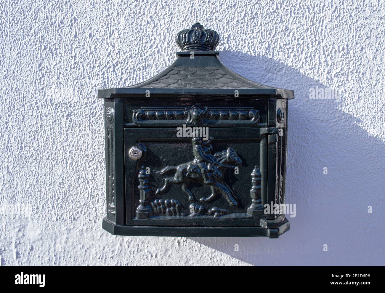 Ancient green mailbox on white wall Stock Photo - Alamy