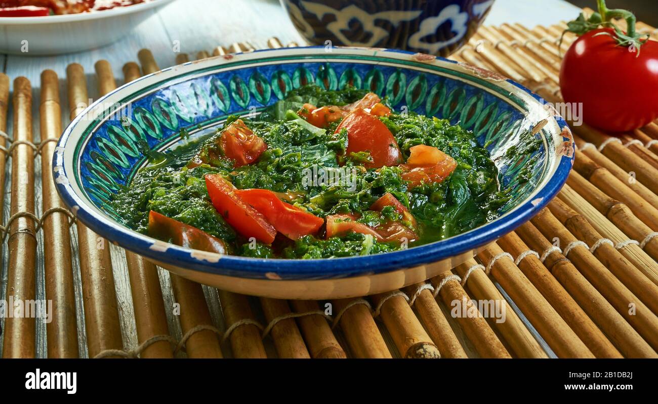 Sukuma Wiki - African Braised Kale with Tomatoes Stock Photo - Alamy