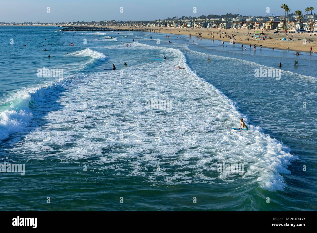 Surfers riding the waves in Newport Beach, California, USA Stock Photo ...