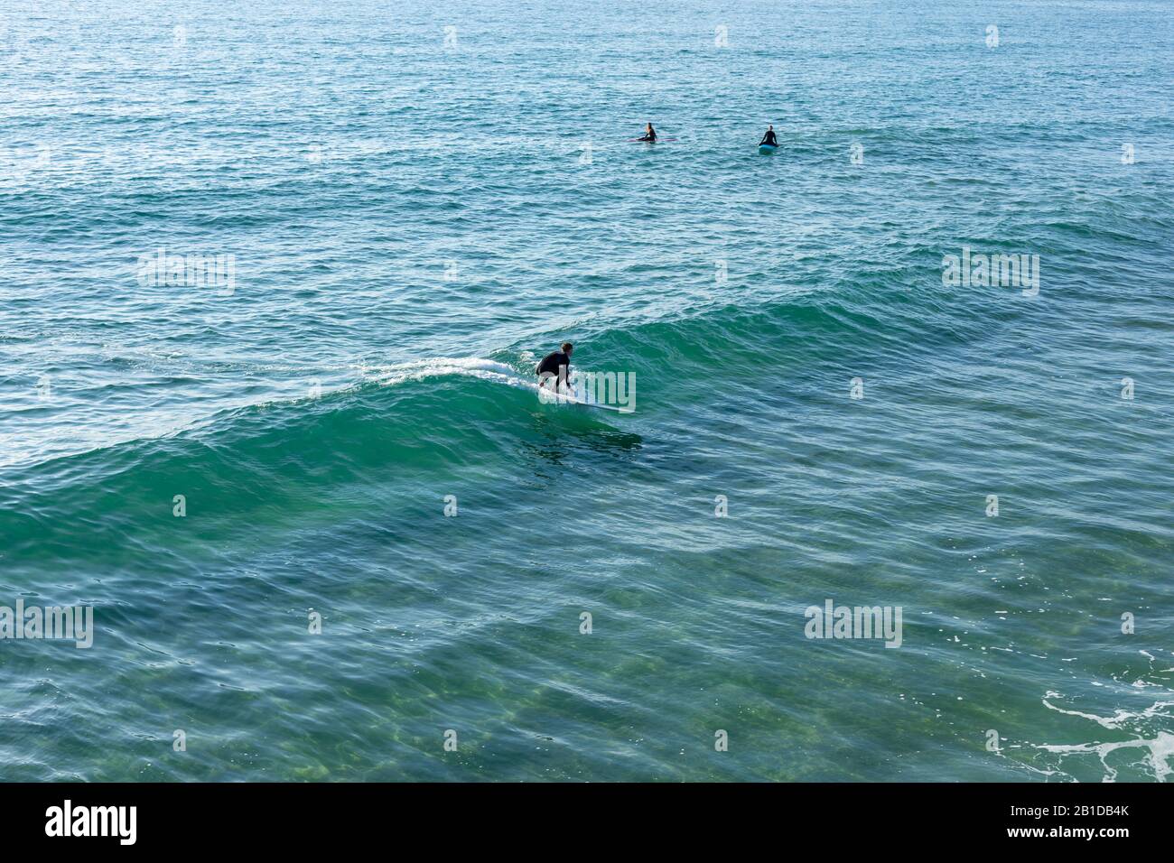 Surfers riding the waves in Newport Beach, California, USA Stock Photo ...