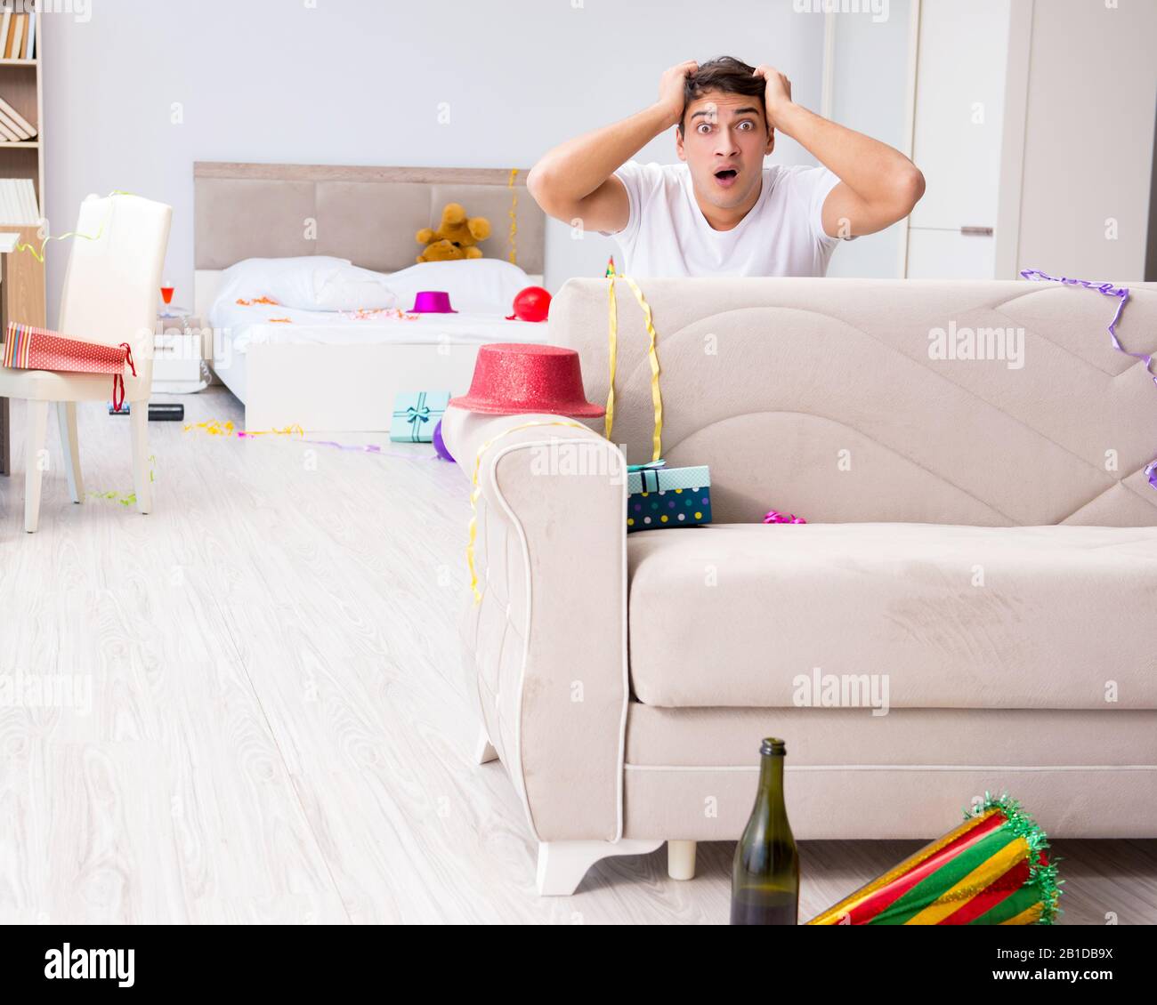 The man at home after heavy partying Stock Photo - Alamy