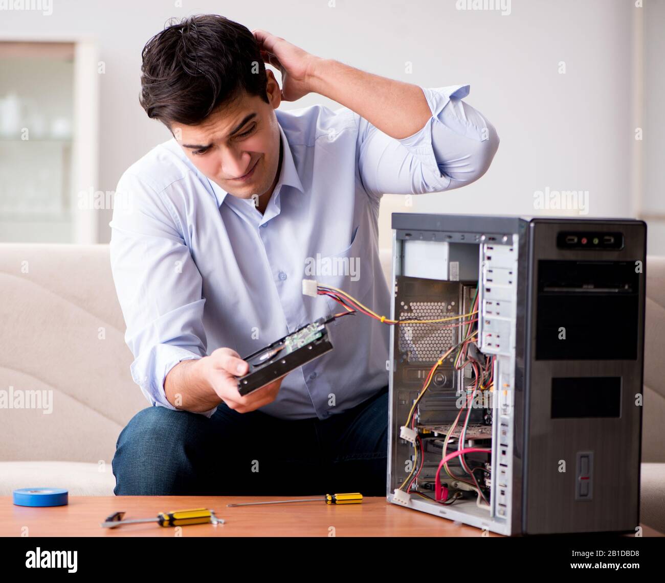 The frustrated man with broken pc computer Stock Photo - Alamy