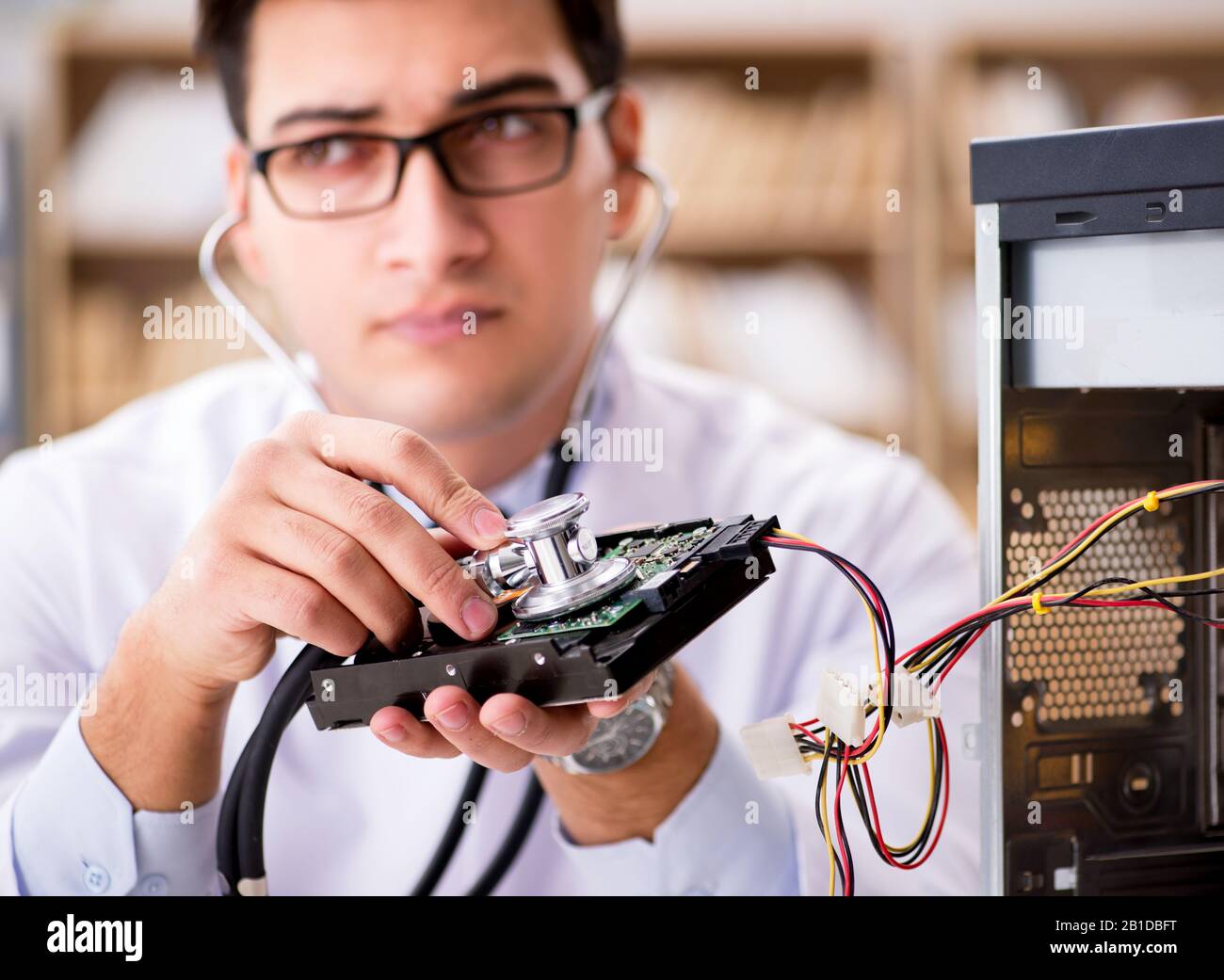 The proffesional repairman repairing broken hard drive Stock Photo - Alamy