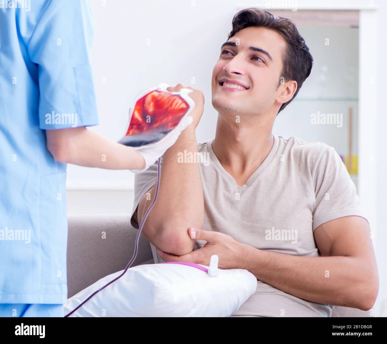 The patient getting blood transfusion in hospital clinic Stock Photo ...