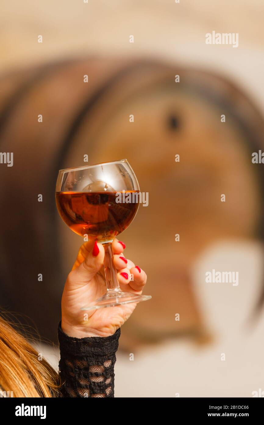 Elegant lady tasting wine in rural cottage interior celler Stock Photo ...
