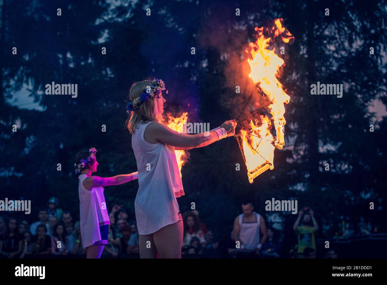 Performance of artists of the fire show in front of the public at the ...