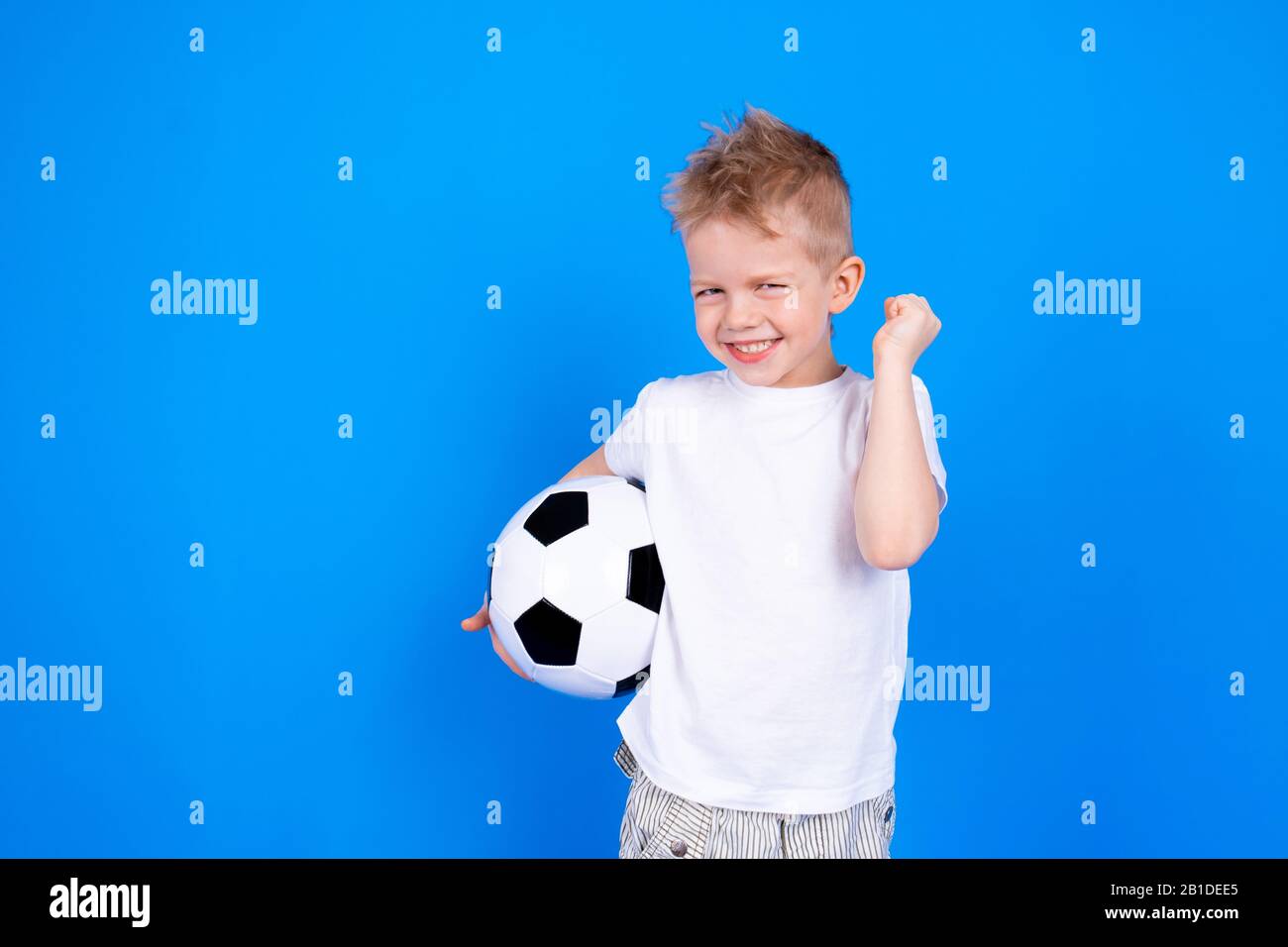 Soccer fans. Cheerful caucasian child boy boy celebrating victory ...