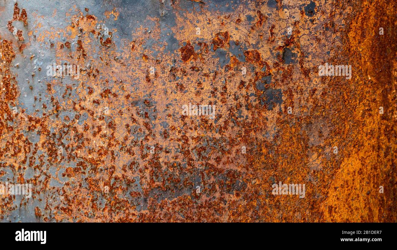 The metal surface is filled with rust that is reddish brown. Gives a ...