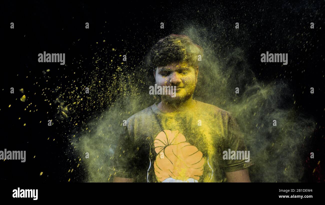 Young man with holi colors. holi is a festival of India. It is festival ...