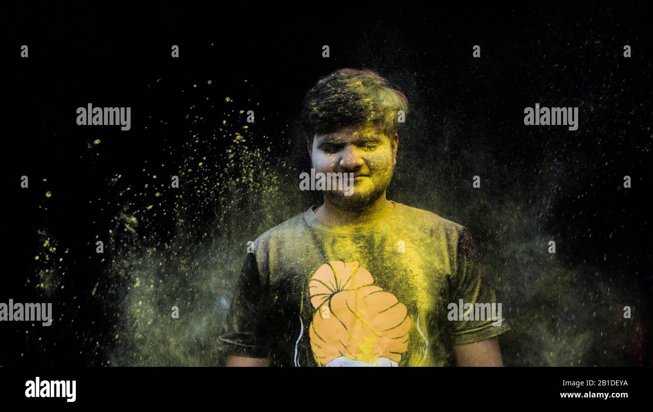 Young man with holi colors. holi is a festival of India. It is festival ...