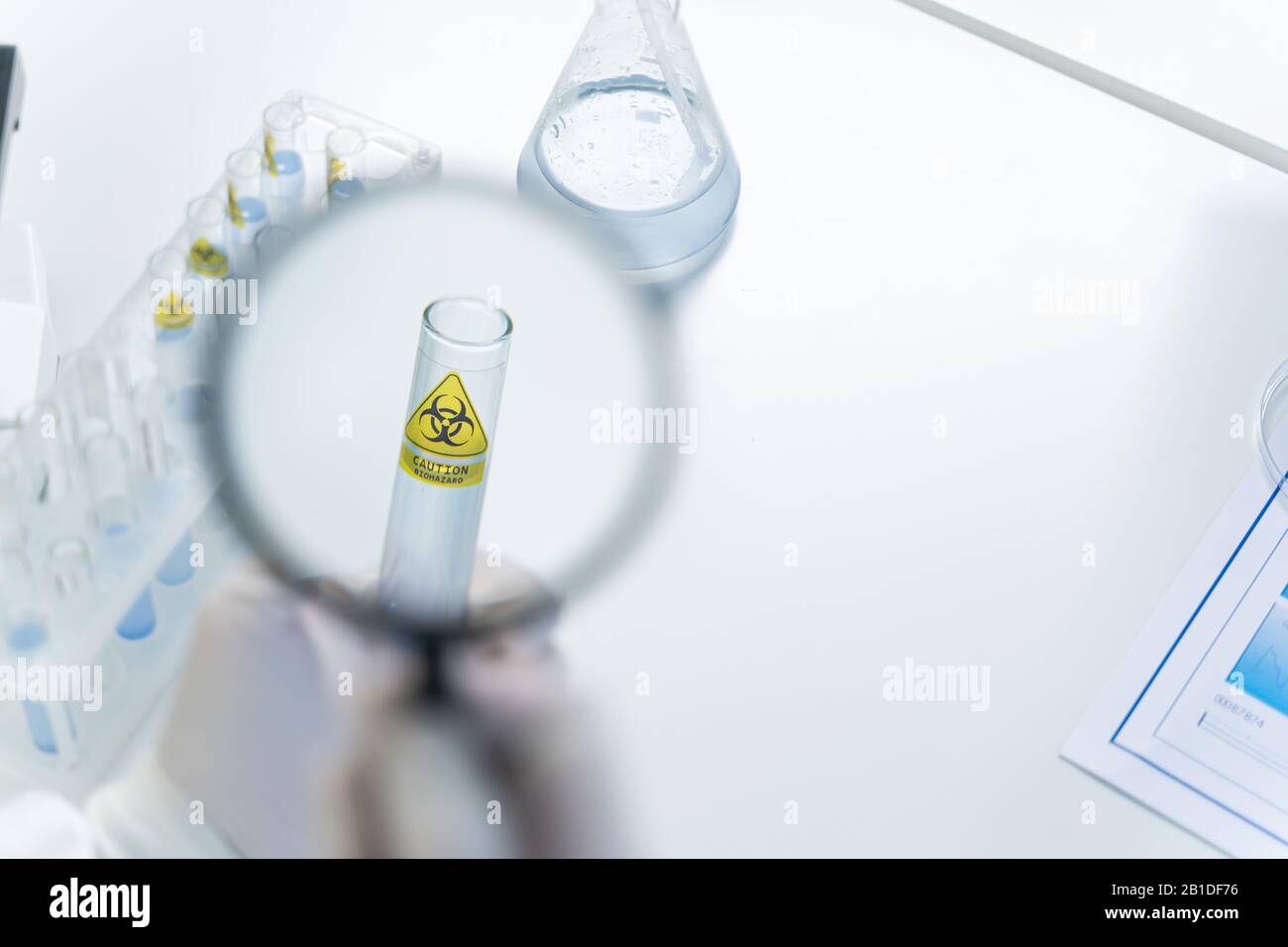 Focused photo on magnifying glass in use Stock Photo - Alamy