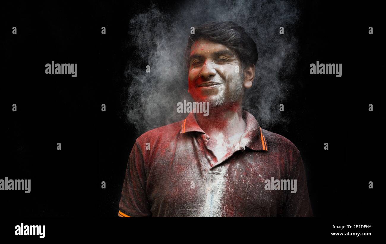 Young man with holi colors. holi is a festival of India. It is festival ...