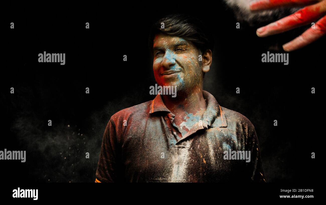 Young man with holi colors. holi is a festival of India. It is festival ...