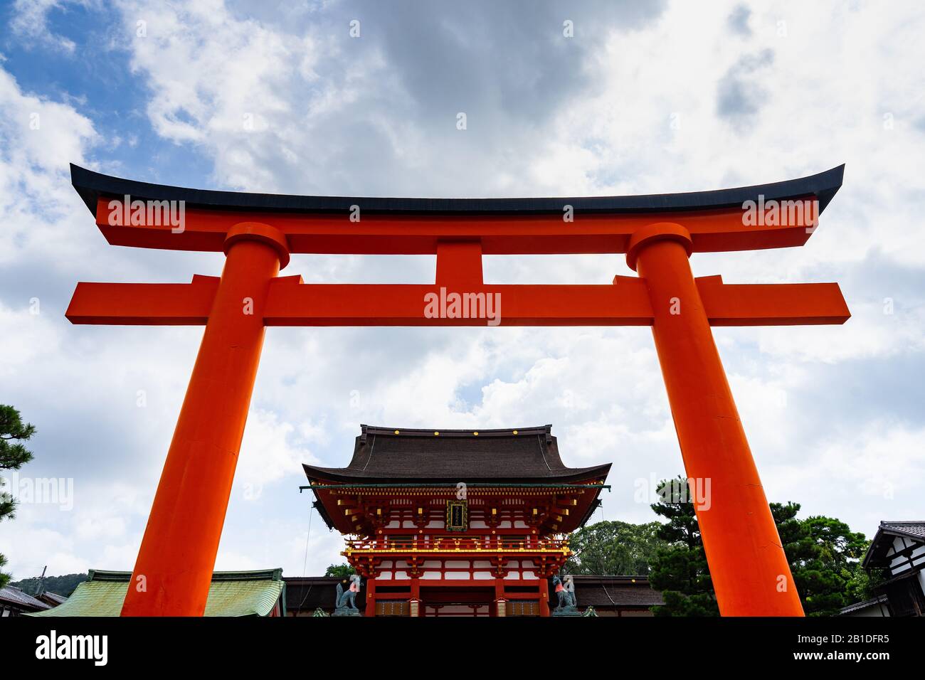 Big orange torii gate at the entrance of Fushimi Inari, the most famous ...