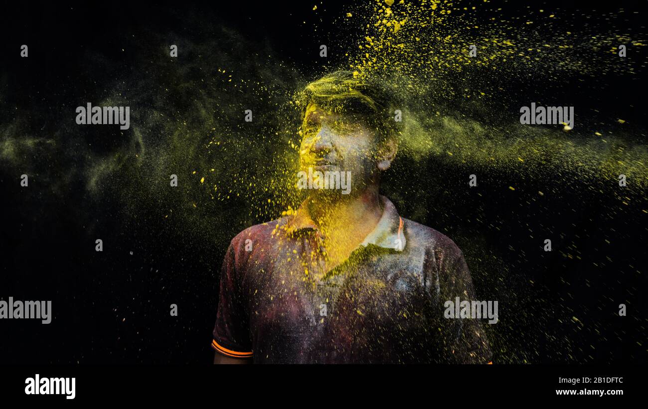 Young man with holi colors. holi is a festival of India. It is festival ...