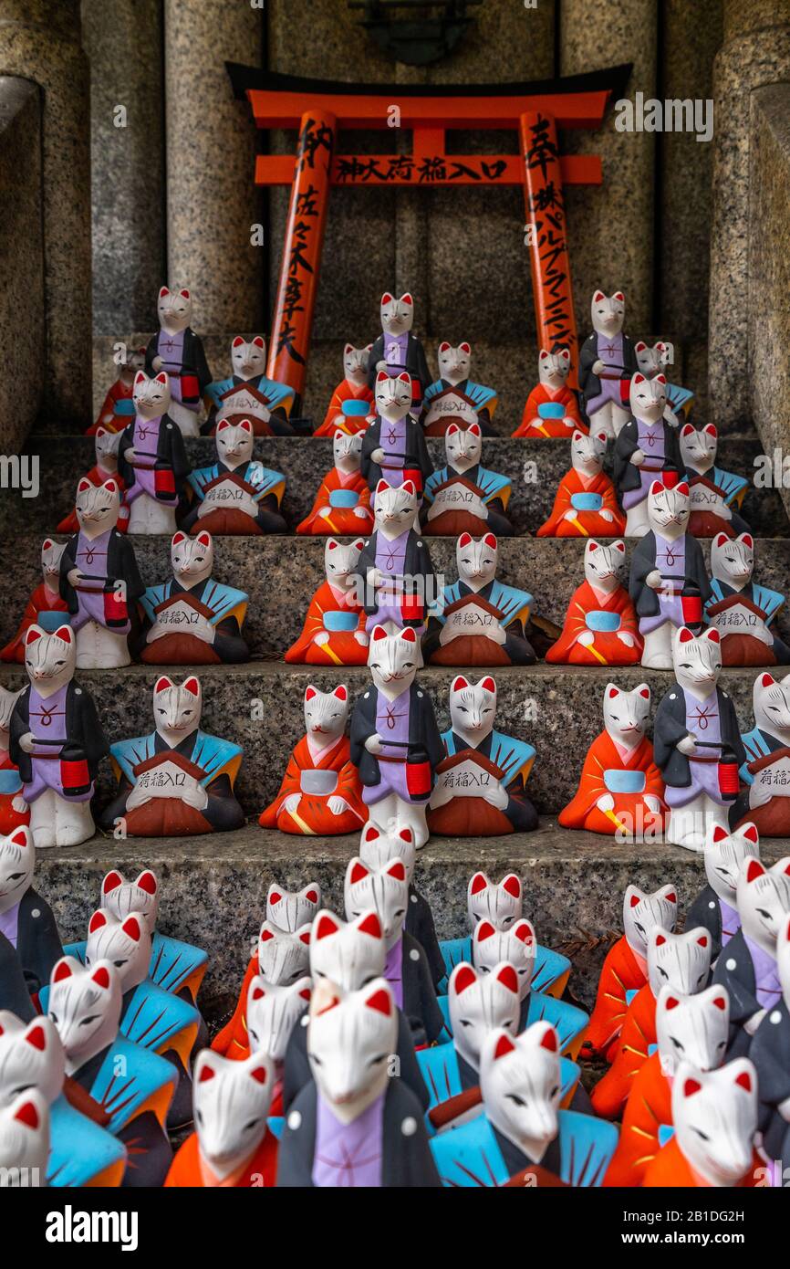 Colorful small statues of fox at Fushimi Inari shrine, Kyoto, Japan ...