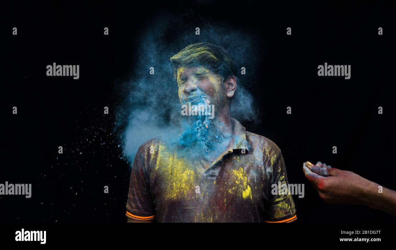 Young man with holi colors. holi is a festival of India. It is festival ...