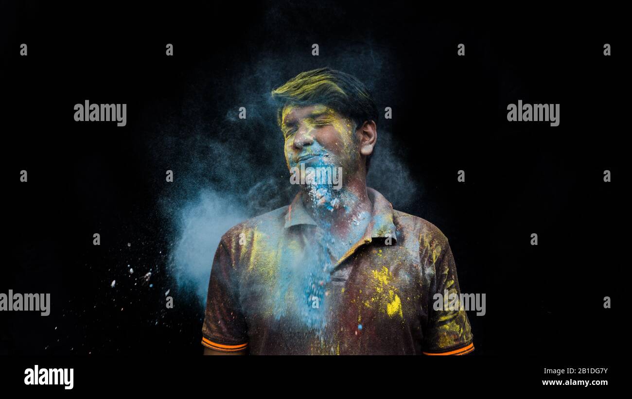 Young man with holi colors. holi is a festival of India. It is festival ...