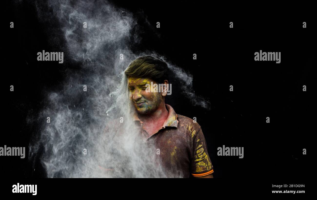 Young man with holi colors. holi is a festival of India. It is festival ...