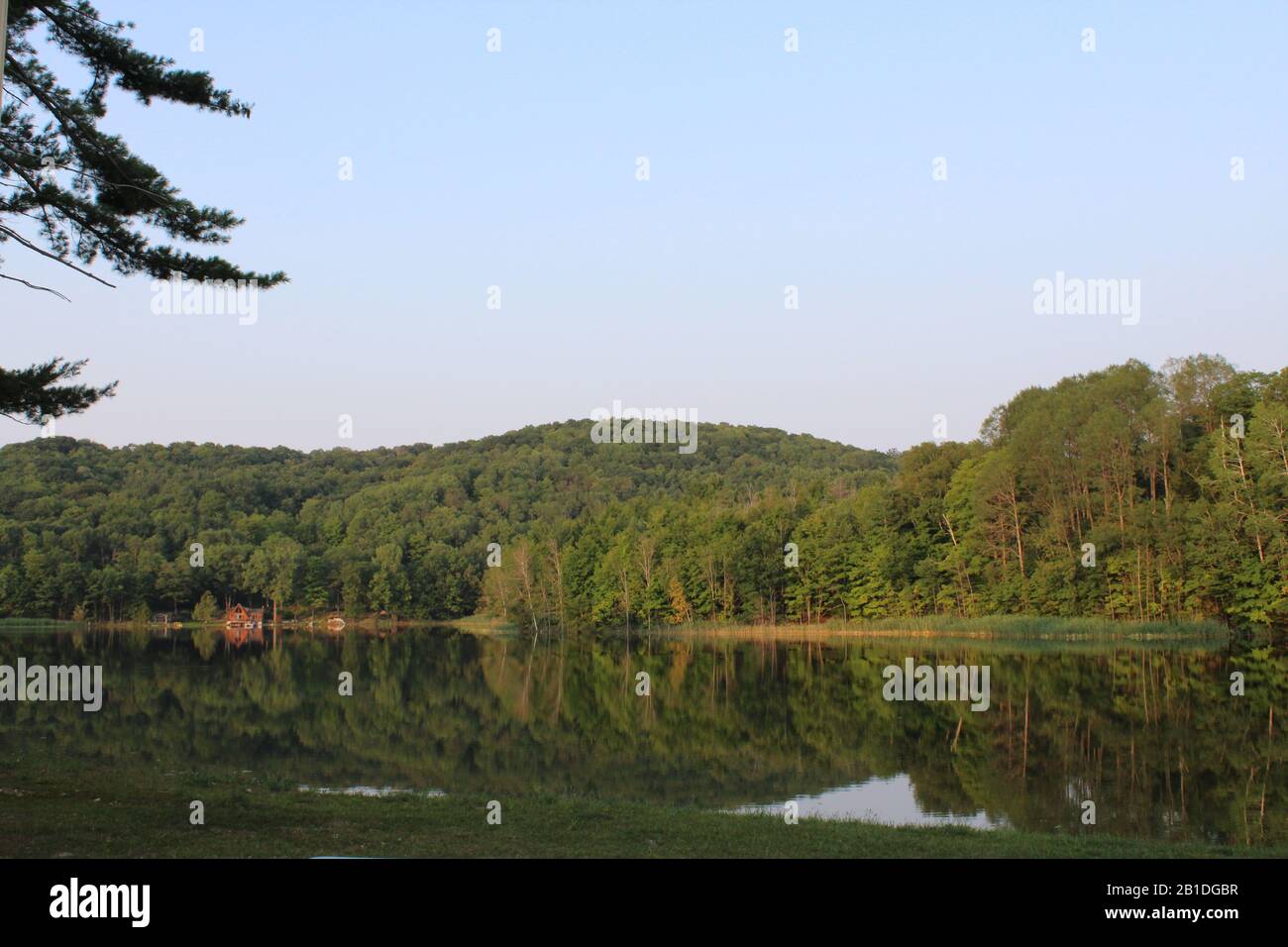 Water reflection over a peaceful lake Stock Photo - Alamy