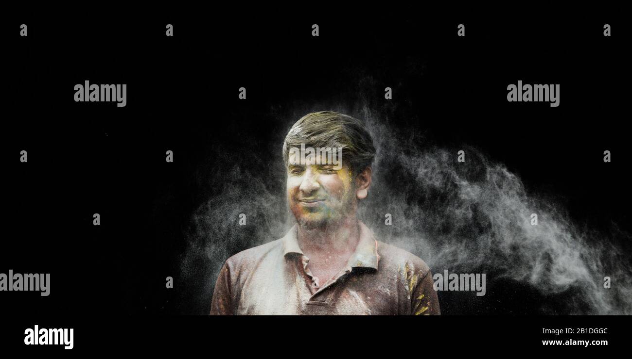 Young man with holi colors. holi is a festival of India. It is festival ...