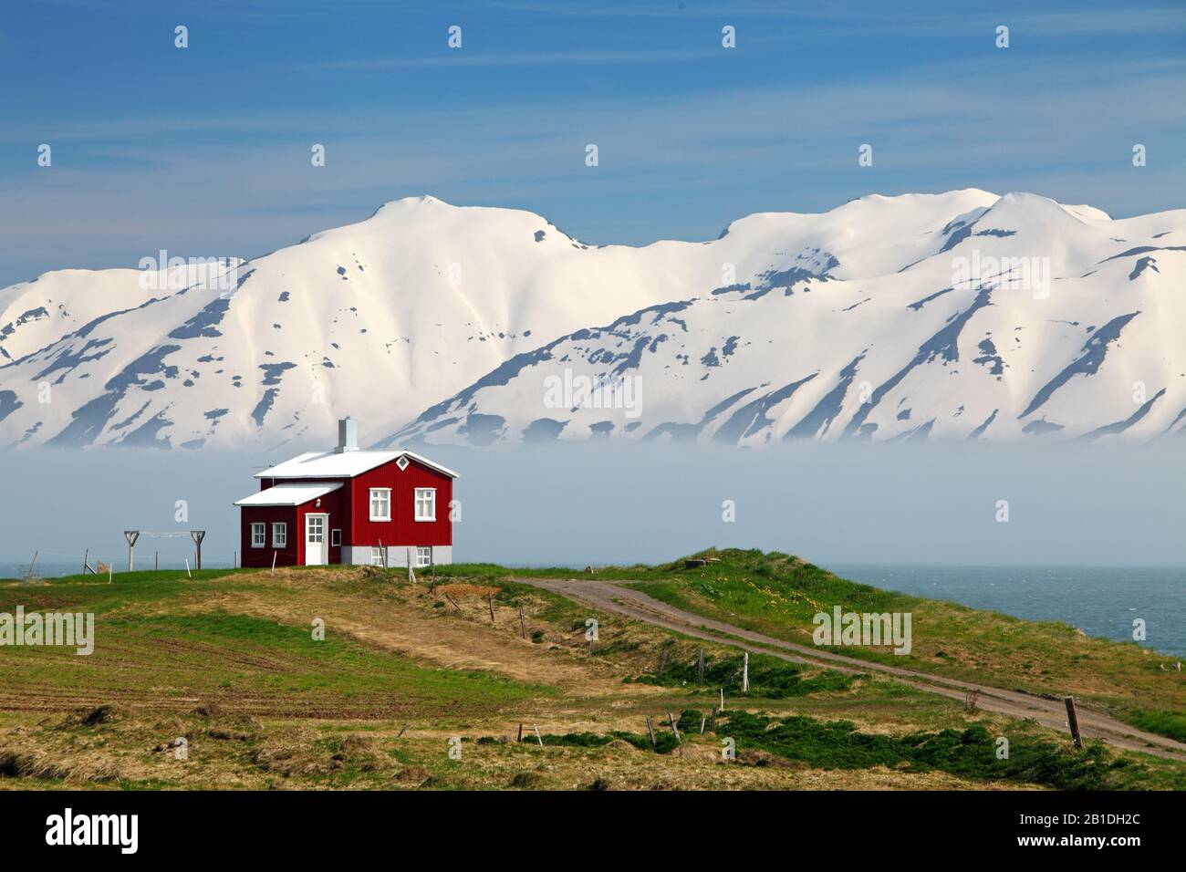 Iceland summer landscape. Fjord, house, mountains Stock Photo - Alamy