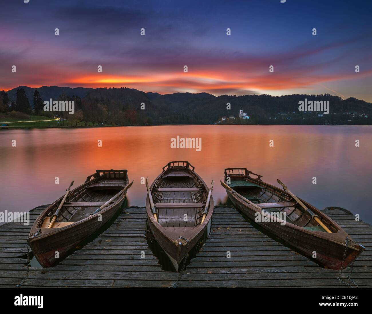 Bled, Slovenia - Traditional boats at Lake Bled with beautiful dramatic ...
