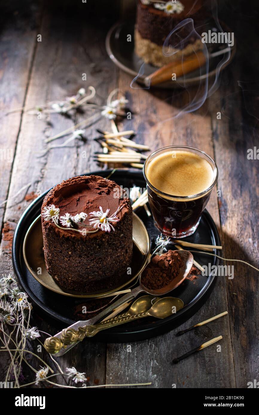 Sweet chocolate cake with coffee.Dessert with cream and nuts.Healthy ...