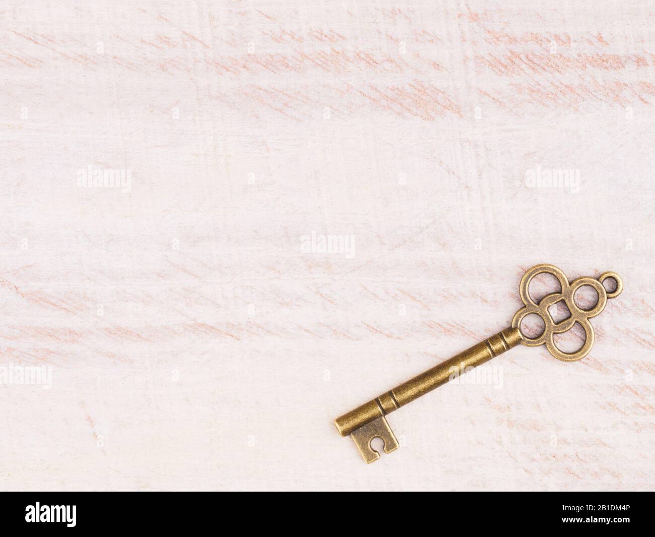 Old bronze key on light brown wooden background with copy space Stock ...