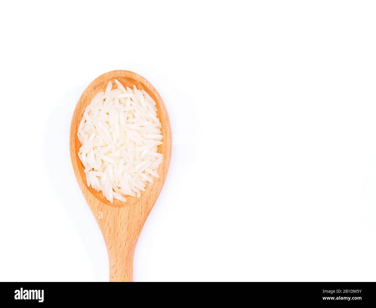 Indian long grain Basmati rice in wooden spoon isolated on white Stock ...