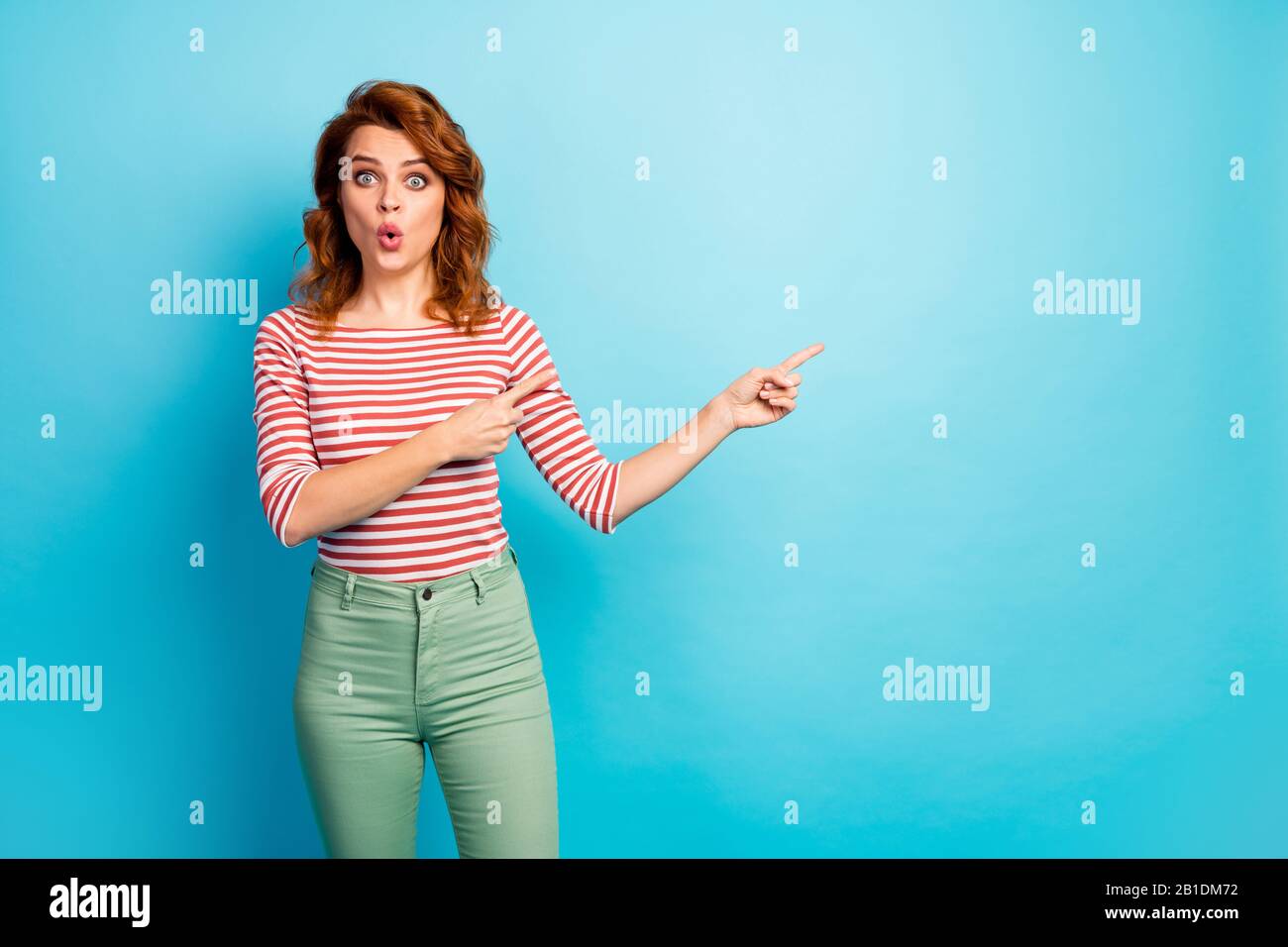 Portrait of astonished woman indicate unbelievable ads promo point ...