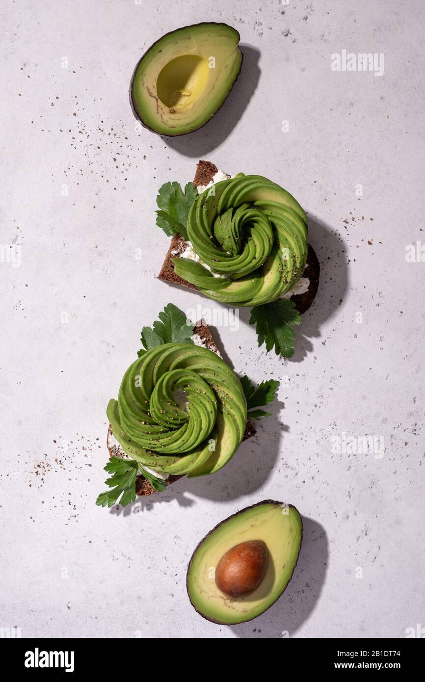 Fresh avocado rose toasts with cream cheese Stock Photo - Alamy