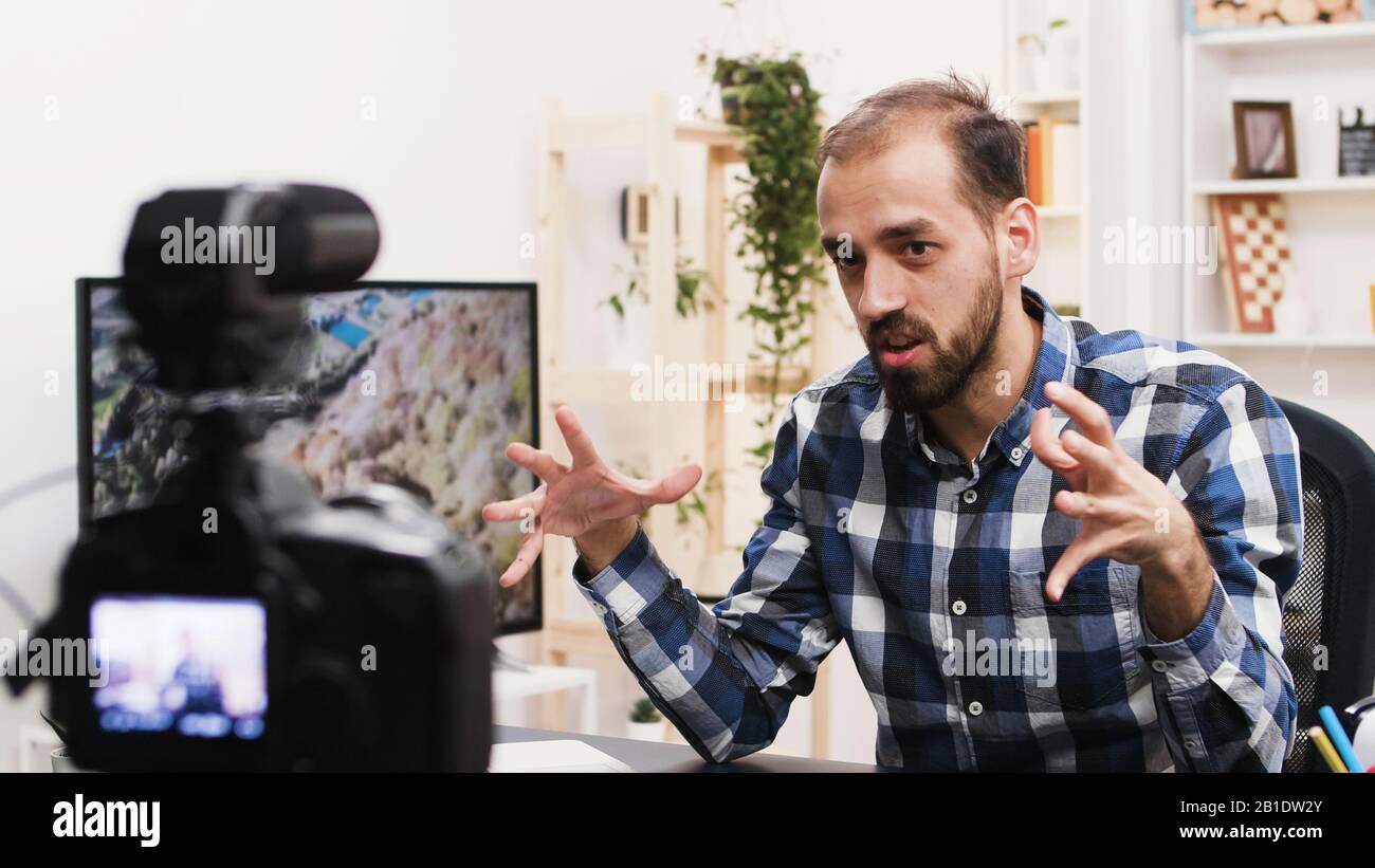Young man recording a vlog for his social media channel. Famous ...