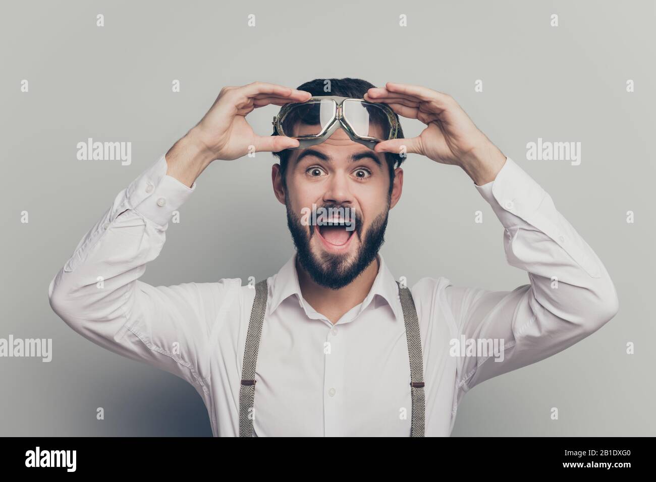 Portrait of astonished guy look unbelievable news information touch ...