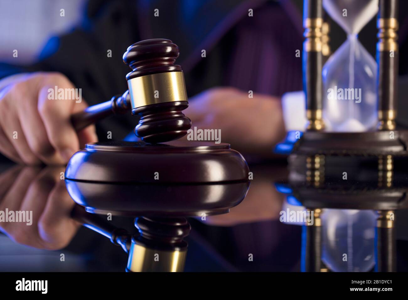 Law and justice theme. Jjudge in toga with the gavel during the trial ...