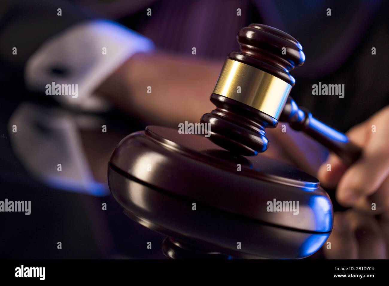 Law and justice theme. Jjudge in toga with the gavel during the trial ...