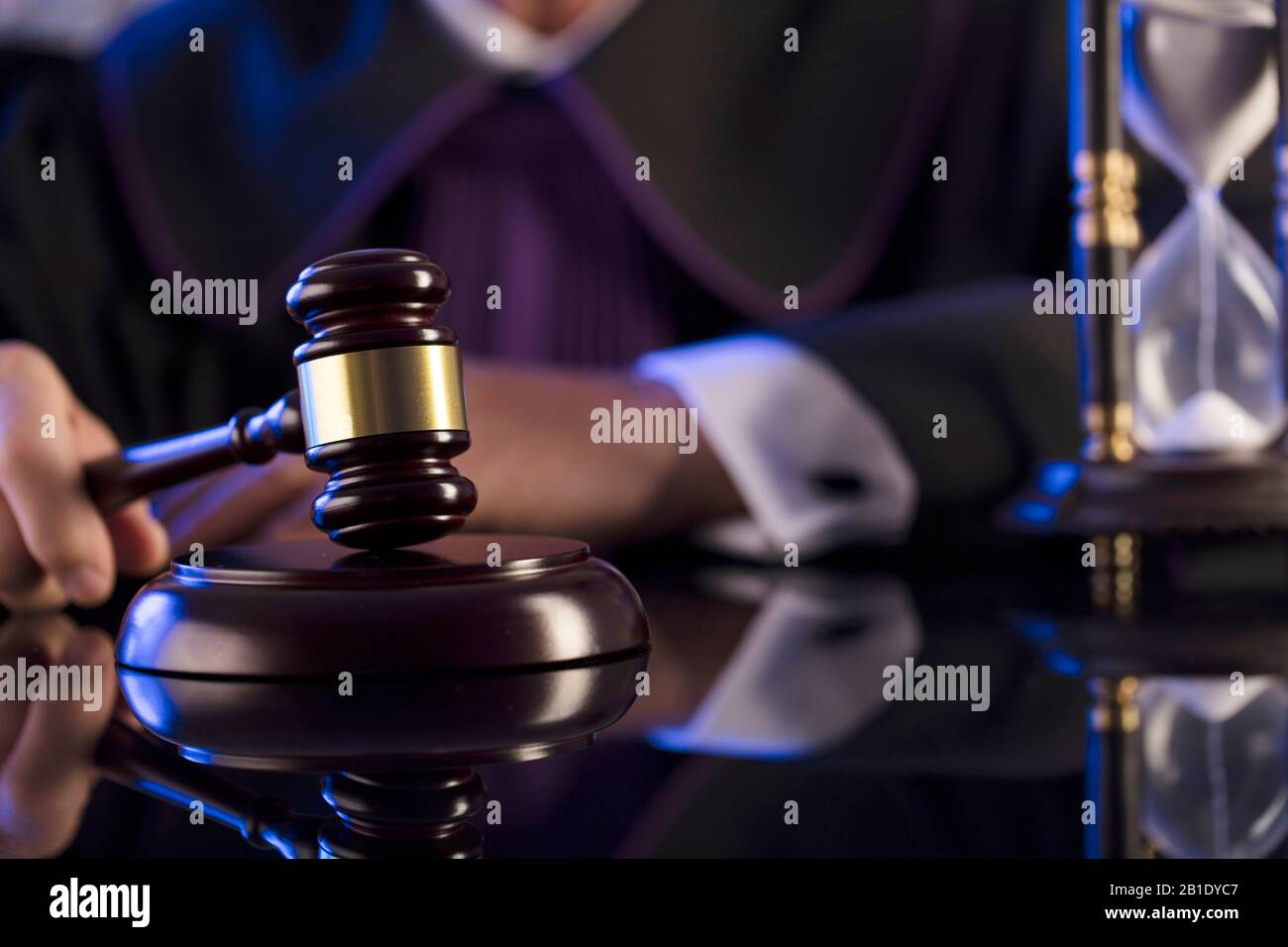 Law and justice theme. Jjudge in toga with the gavel during the trial ...