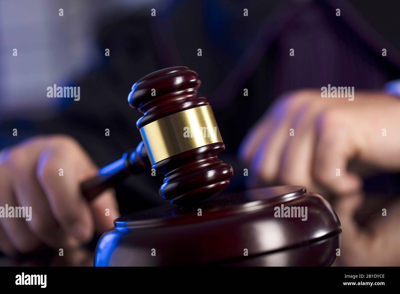 Law and justice theme. Jjudge in toga with the gavel during the trial ...