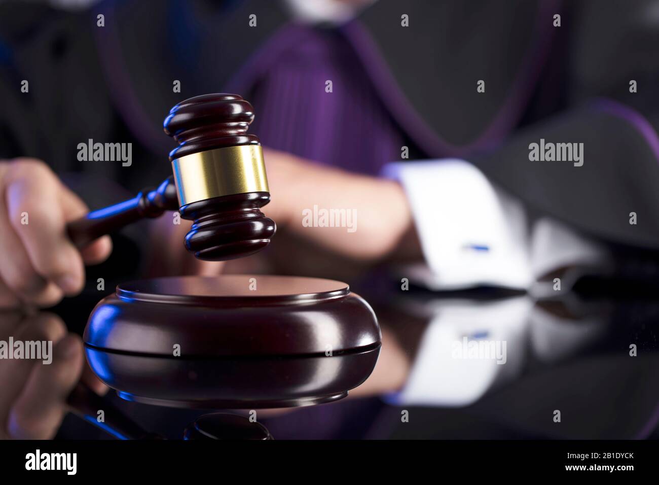 Law and justice theme. Jjudge in toga with the gavel during the trial ...