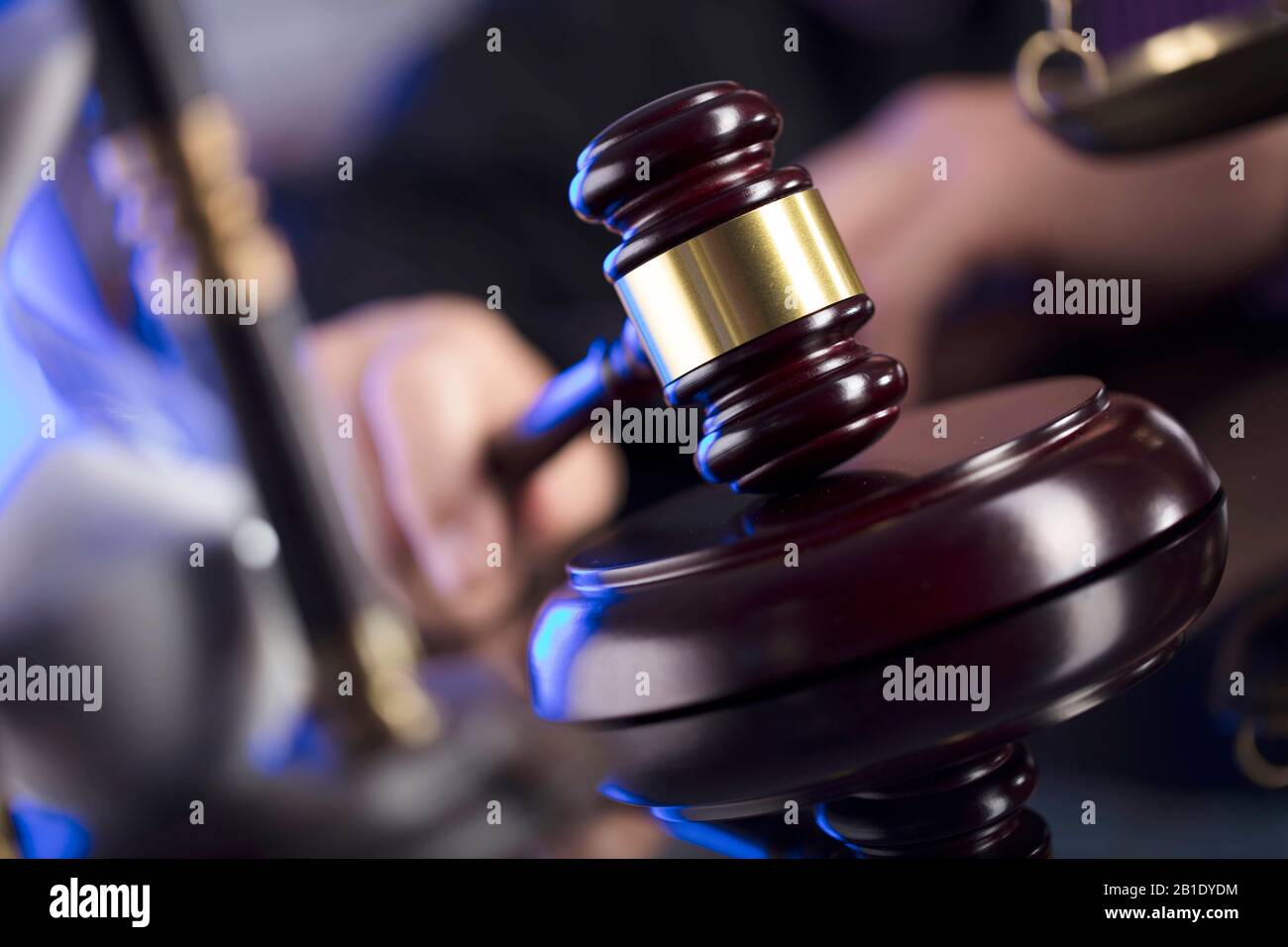 Law and justice theme. Jjudge in toga with the gavel during the trial ...