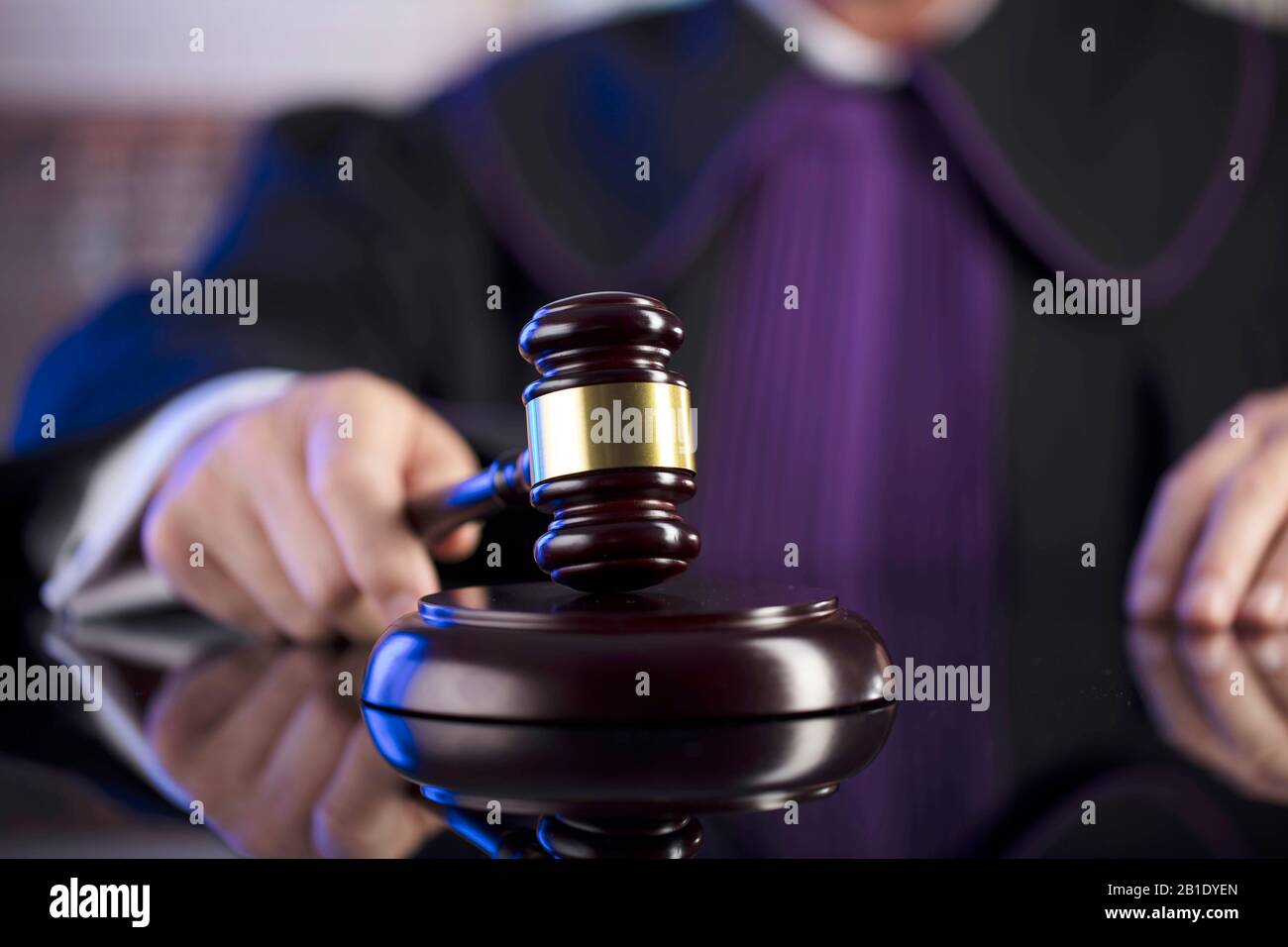 Law and justice theme. Jjudge in toga with the gavel during the trial ...