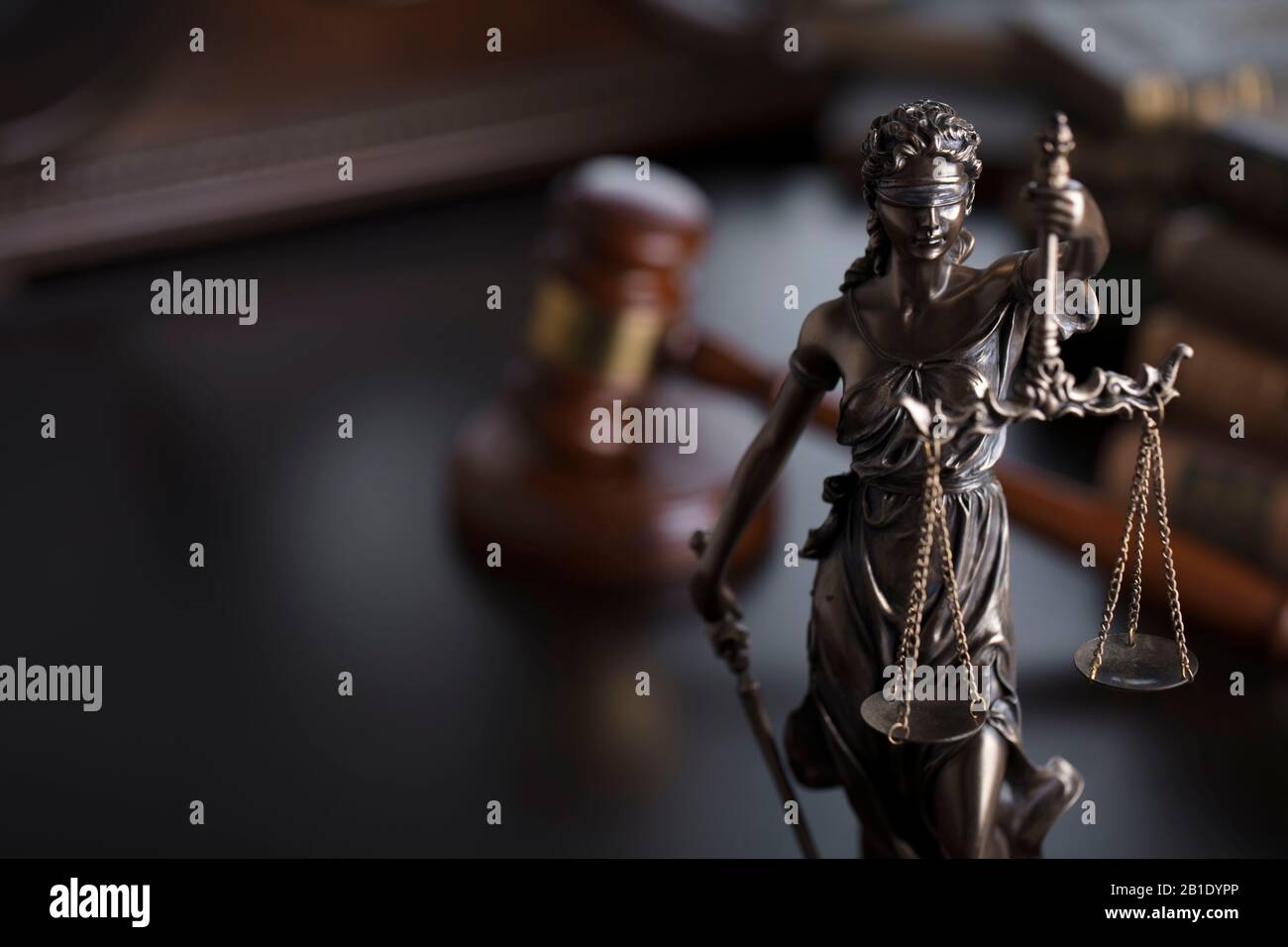 Lawyers office. Themis statue, gavel and legal books on lawyer desk ...