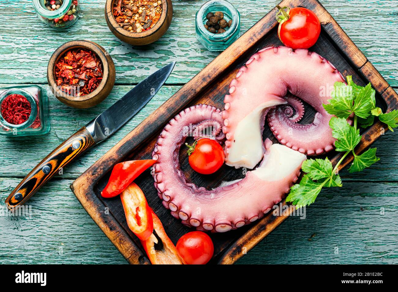 Tentacles of raw octopus on kitchen board.Food diet,healthy eating ...