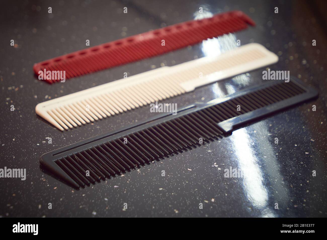 Three Hair Combs, hair cutting tools Stock Photo - Alamy