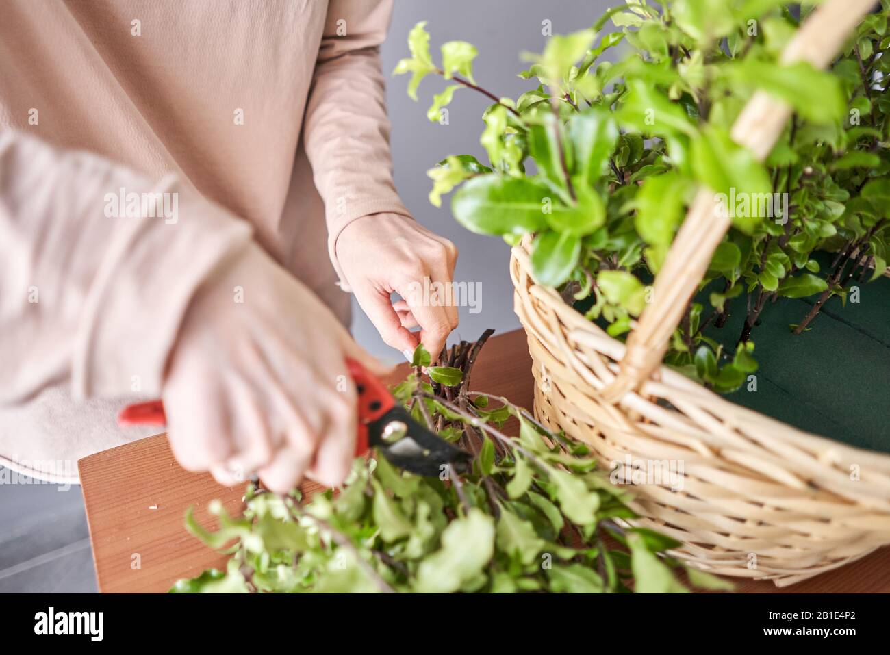 Floral shop concept . Florist woman creates flower arrangement in a ...