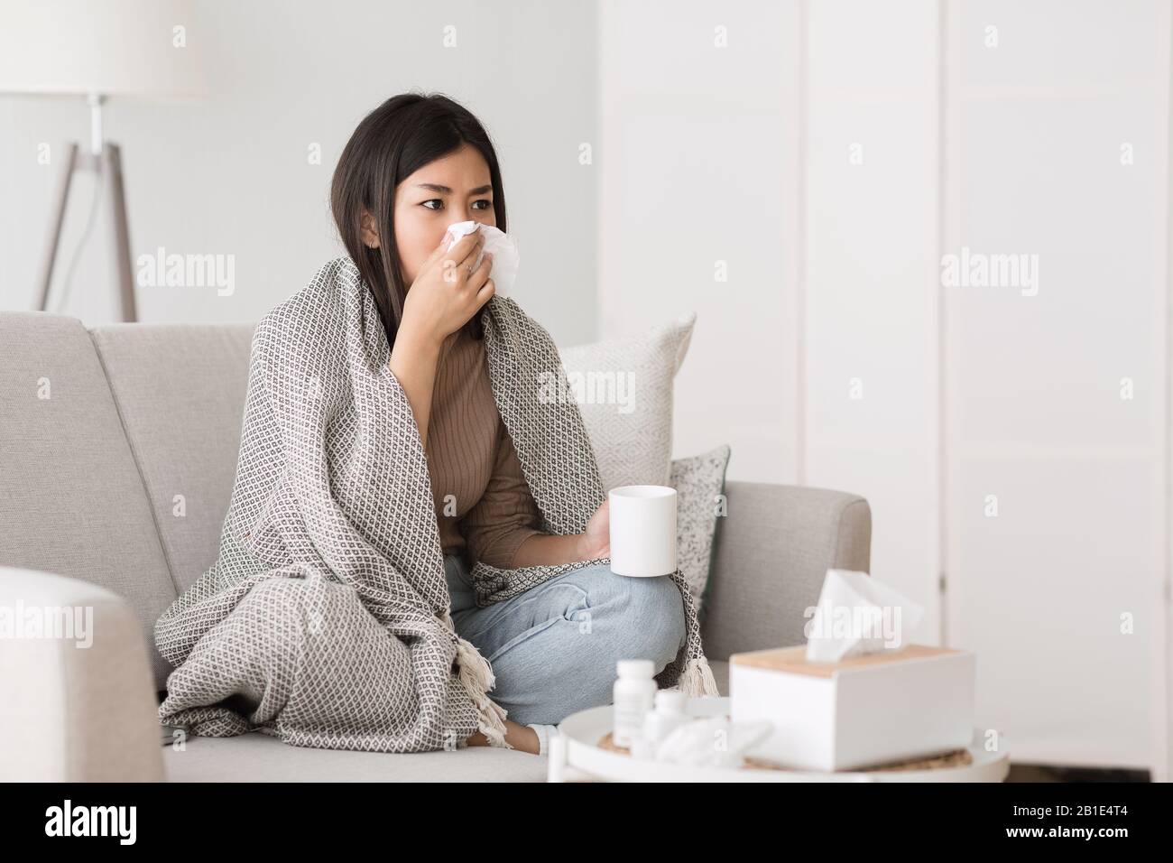 Asian girl blowing nose hi-res stock photography and images - Alamy